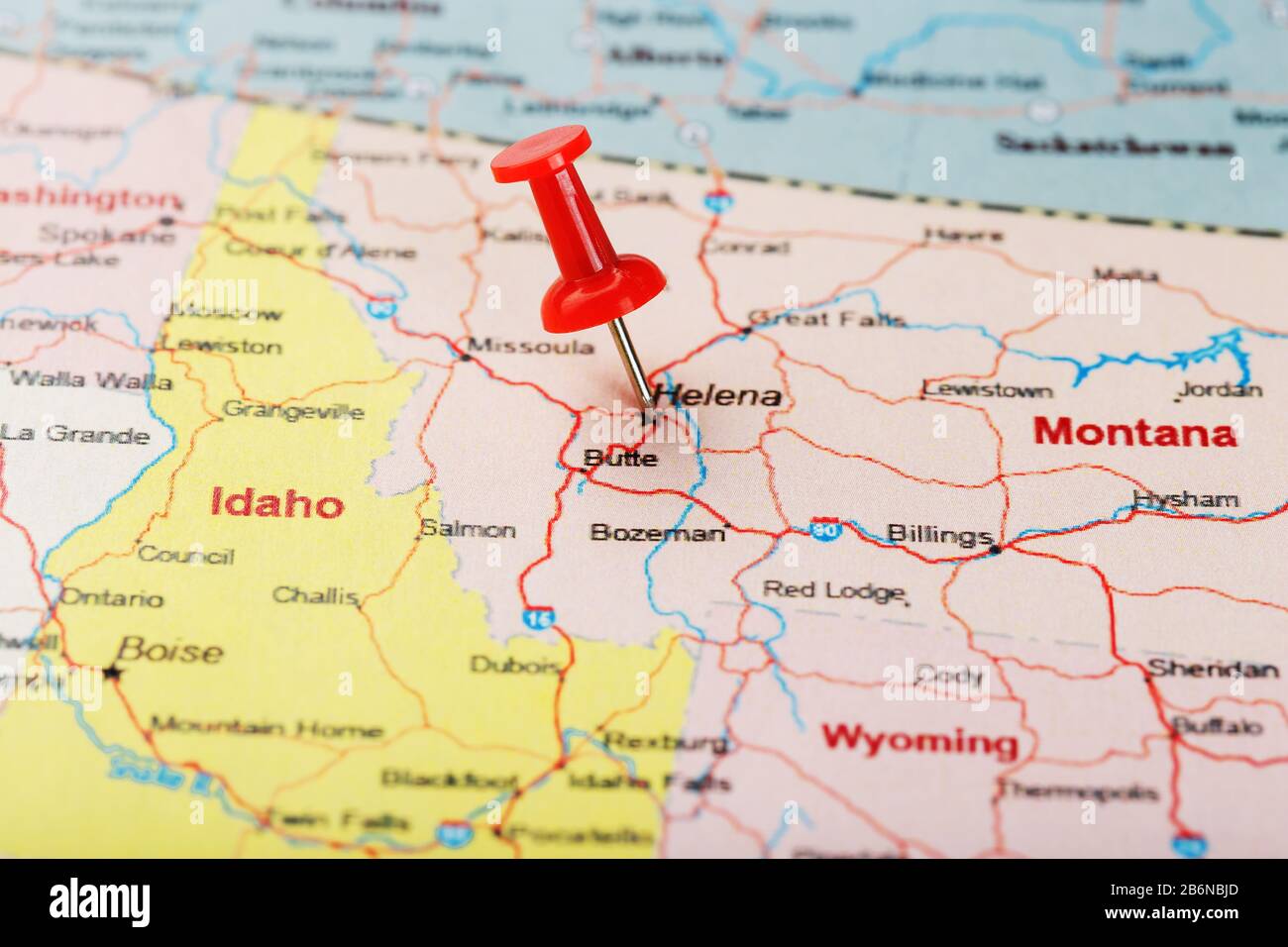 Red clerical needle on a map of USA, Montana and the capital of Helena ...