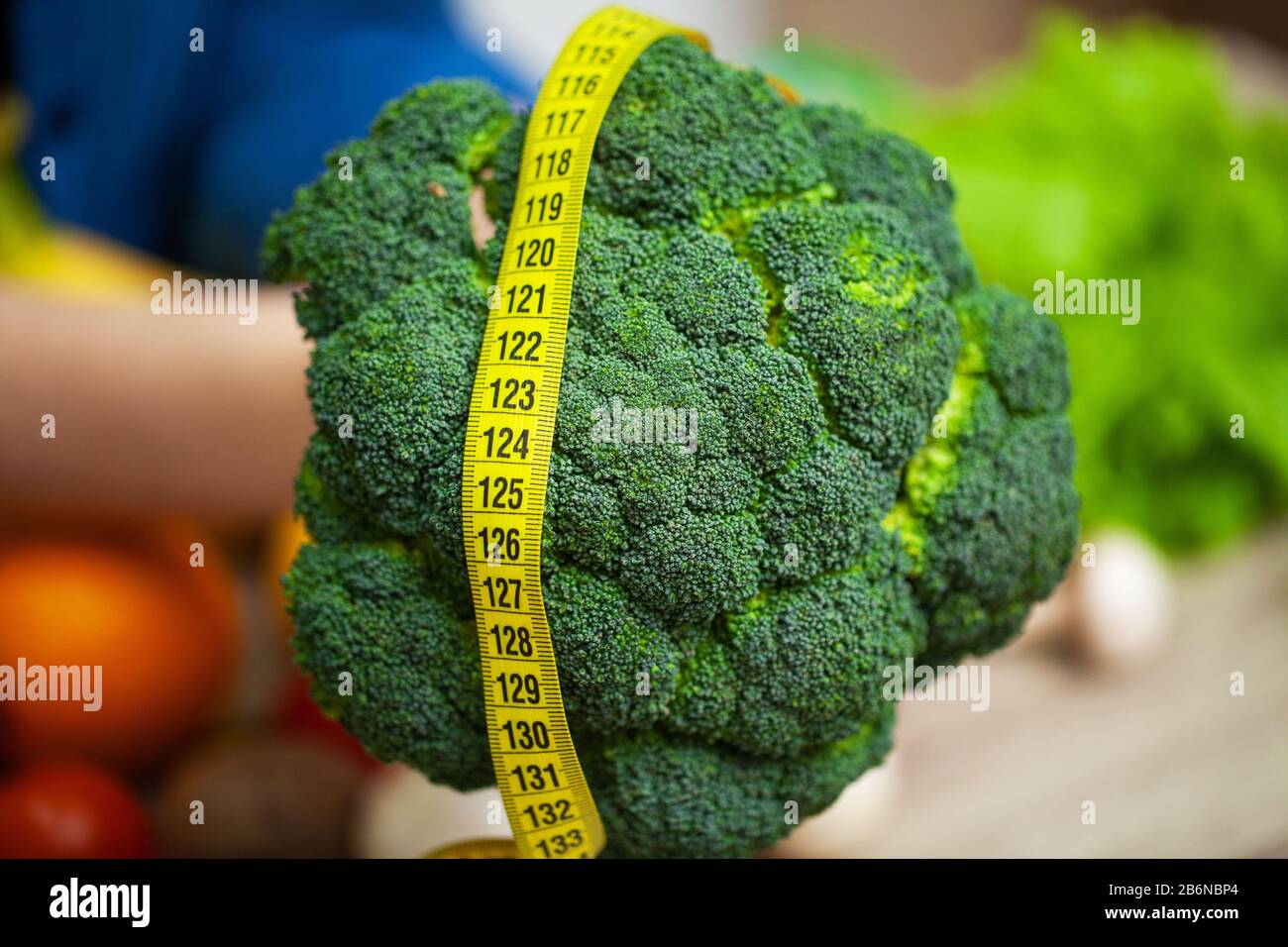 Concept of healthy food, broccoli with yellow tape measure Stock Photo ... Concept of healthy food, broccoli with yellow tape measure Stock Photo ...