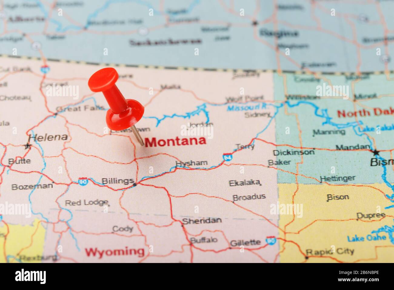 Red clerical needle on a map of USA, Montana and the capital of Helena ...
