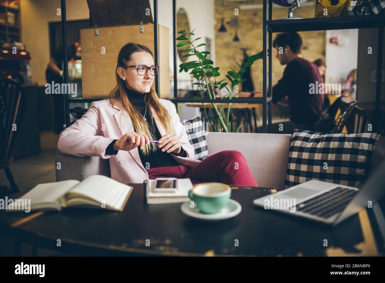 Dreaming pretty lady thinking of ideas sitting in cafe, creative ...