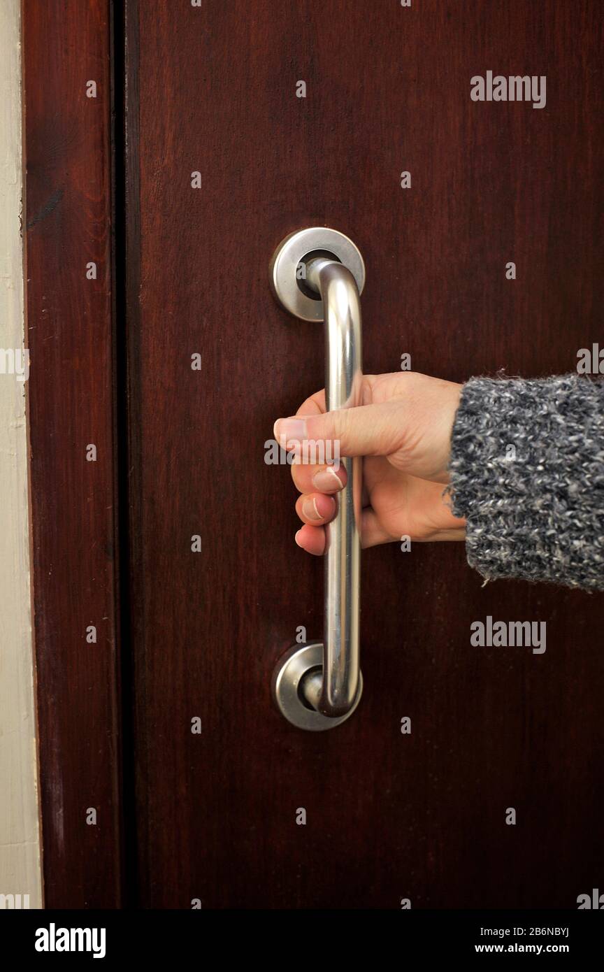 Danger of transmitting coronavirus corvid-19 by putting hands on door ...