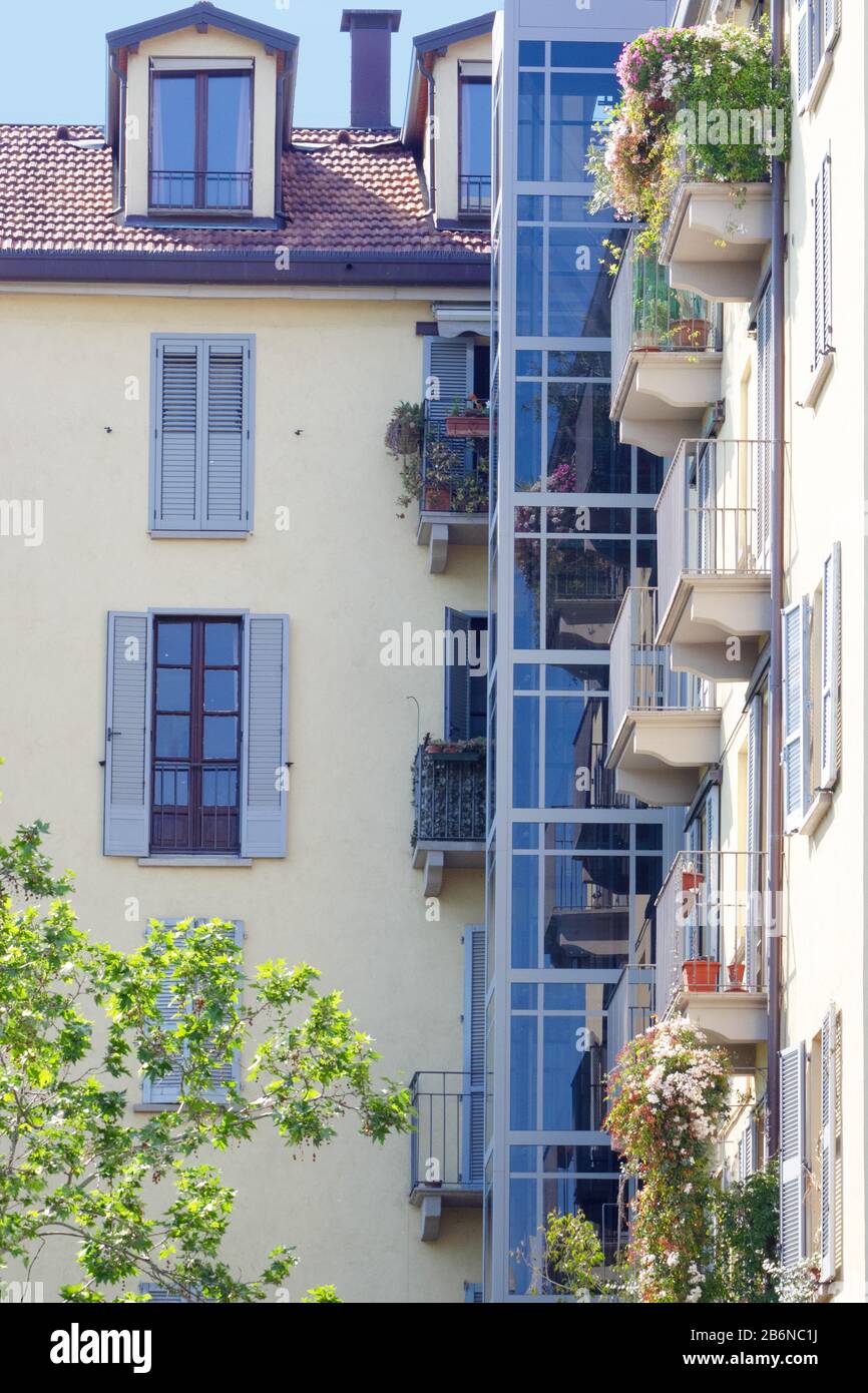 modern lift installed along the facade in the internal courtyard of a ...