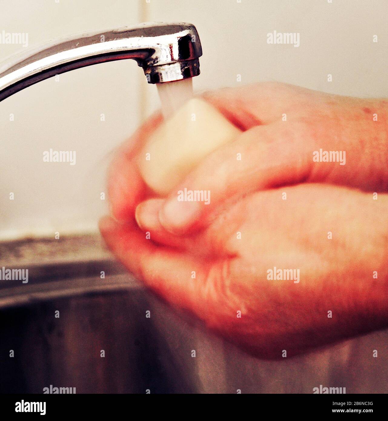 Effective hand washing with soap and water to help stop spread of ...