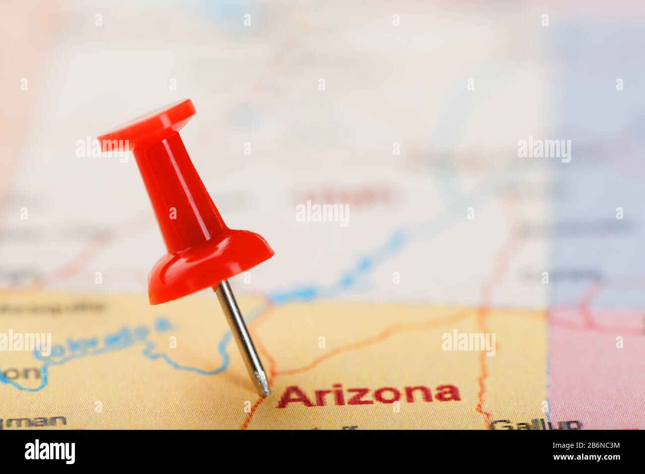 Red clerical needle on a map of USA, Arizona and the capital Phoenix ...