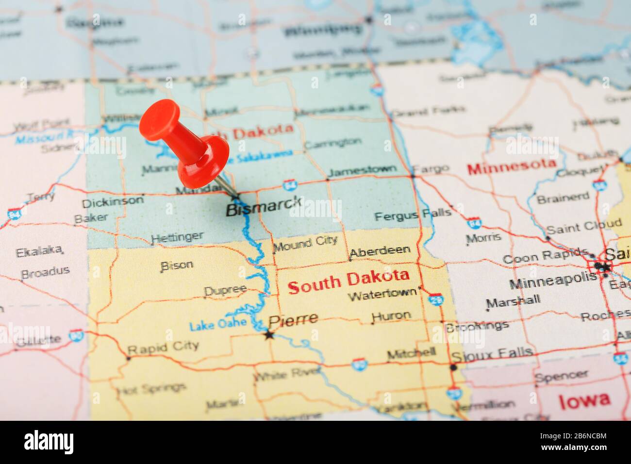 Red clerical needle on a map of USA, Wyoming and the capital Cheyenne ...