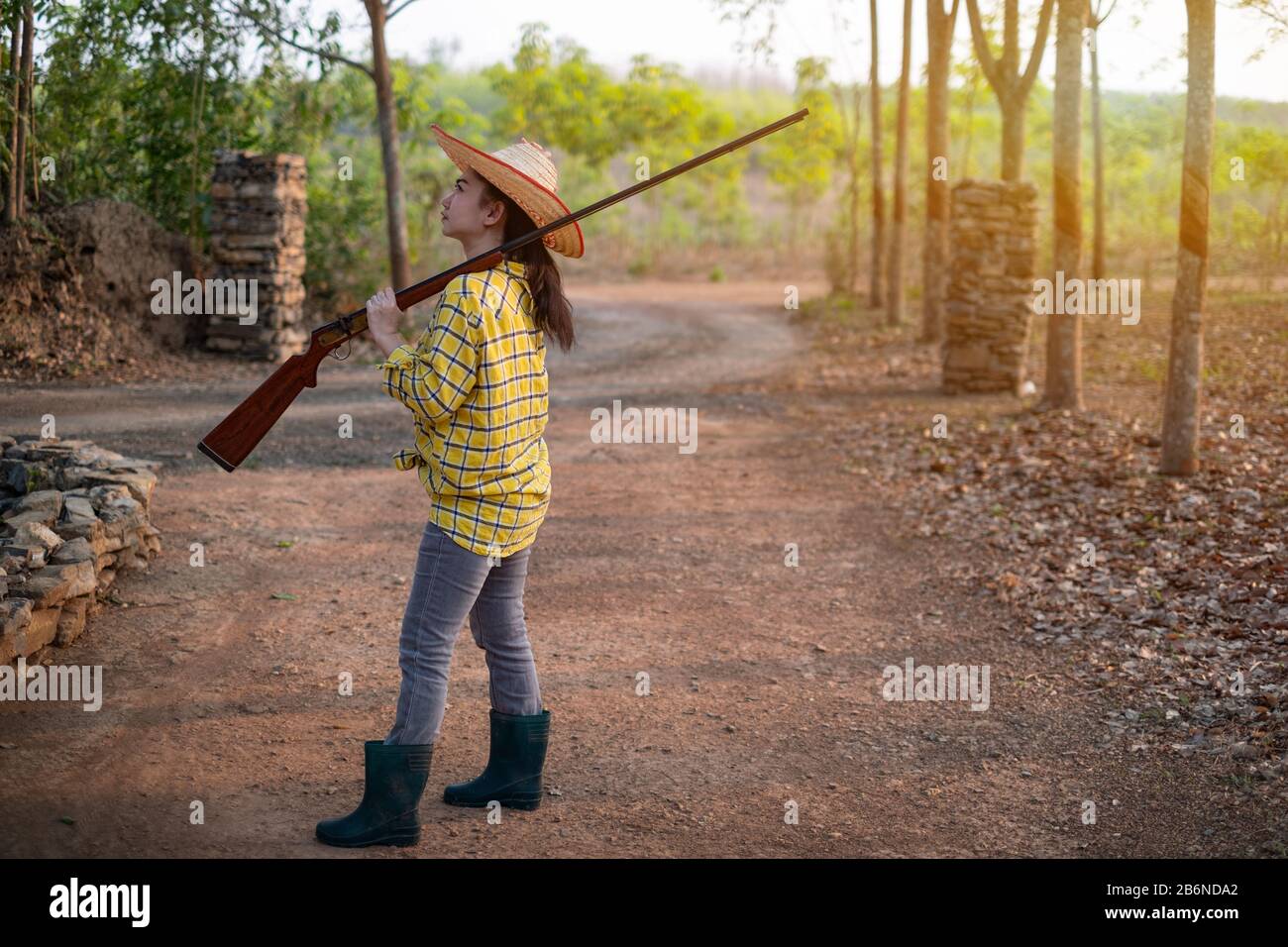 Portrait the farmer asea woman wearing a hat hand holding muzzle ...