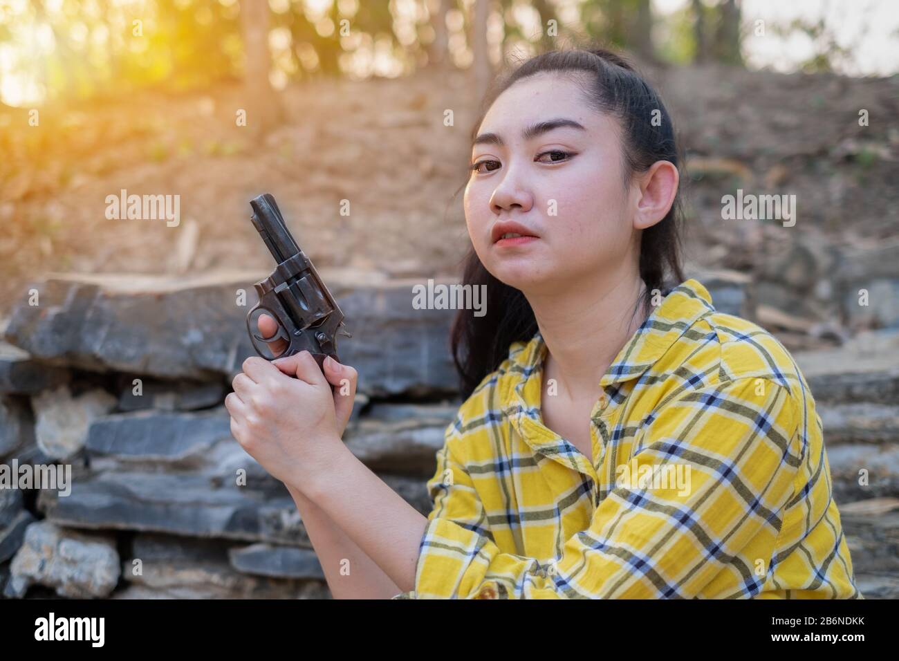 Portrait the farmer asea woman wearing a yellow Shirt hand holding old ...