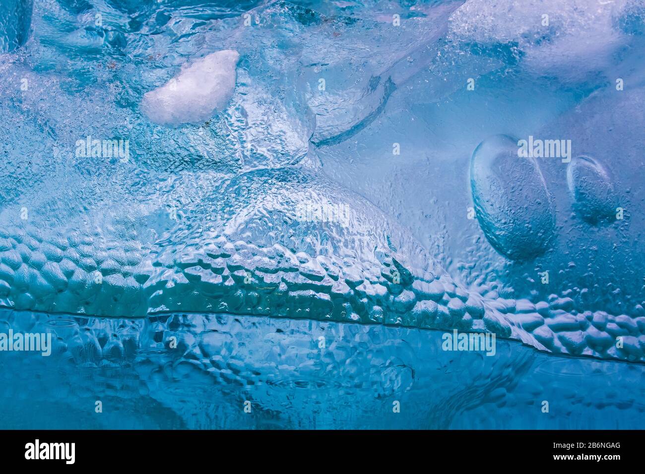 Abstract pattern in melting ice floe / iceberg showing texture due to ...