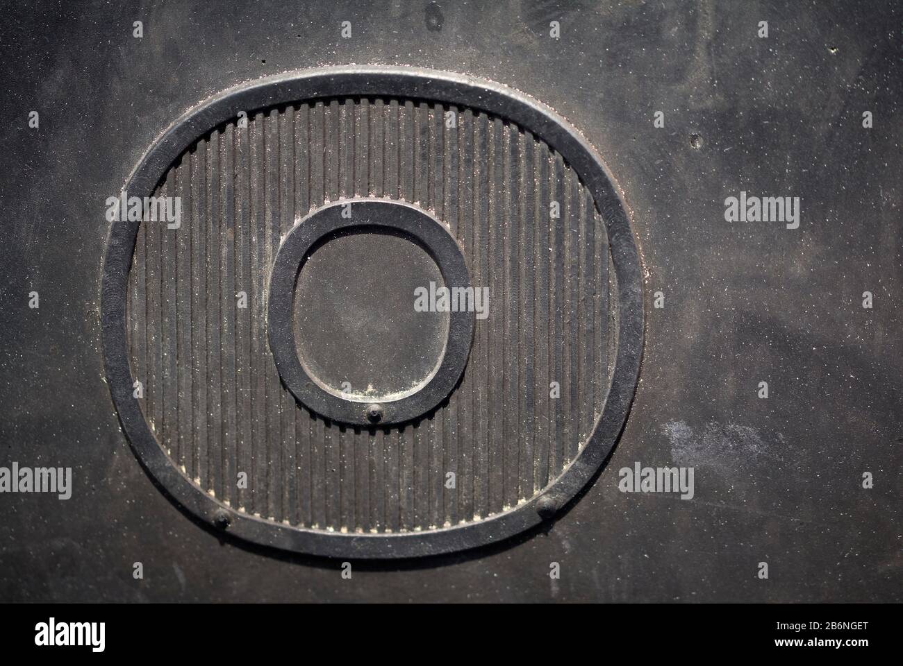 detail of the number "0" or letter "O" engraved on a wheel of a vehicle ...
