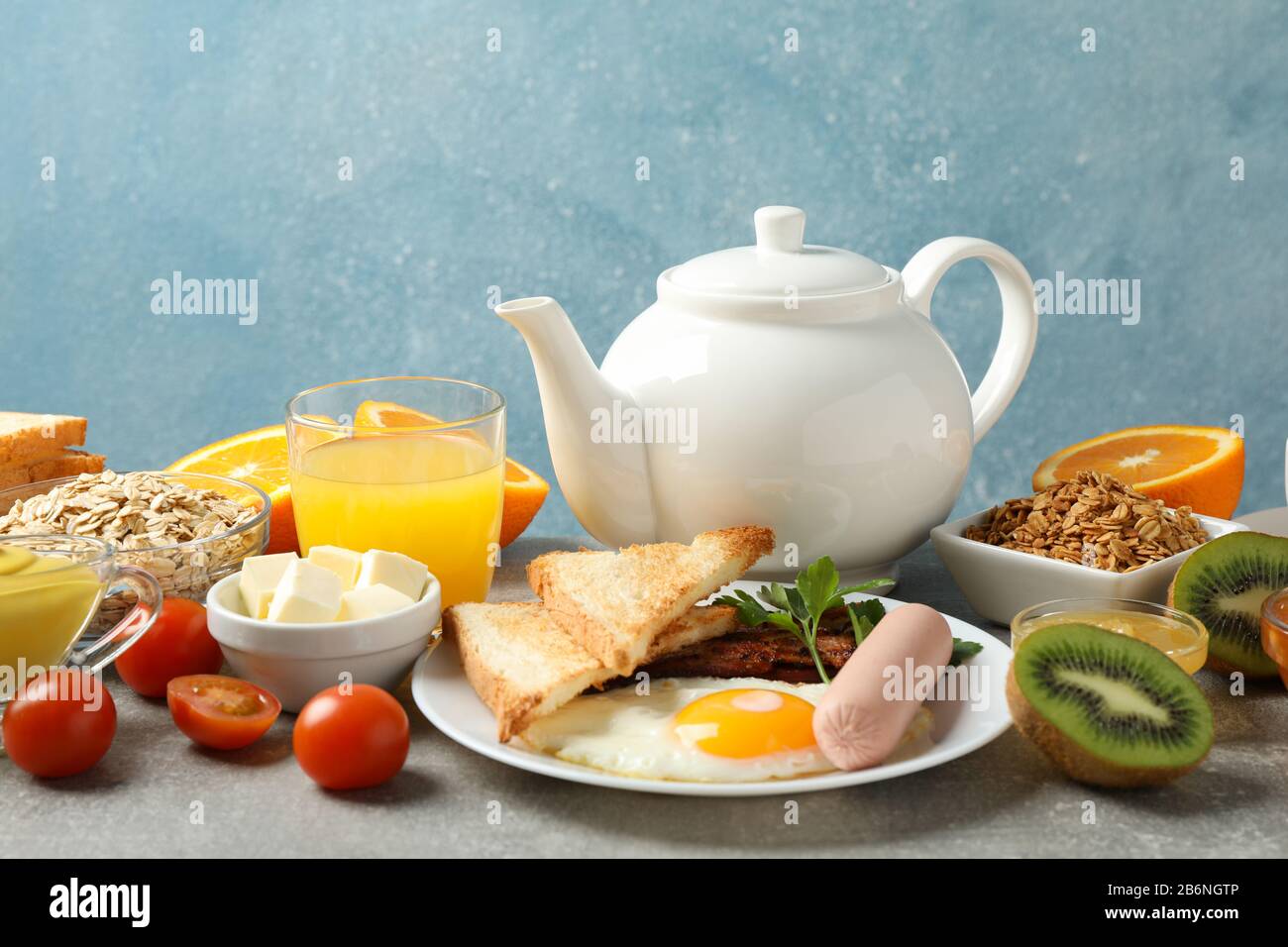 Delicious breakfast or lunch background. Grey table Stock Photo - Alamy