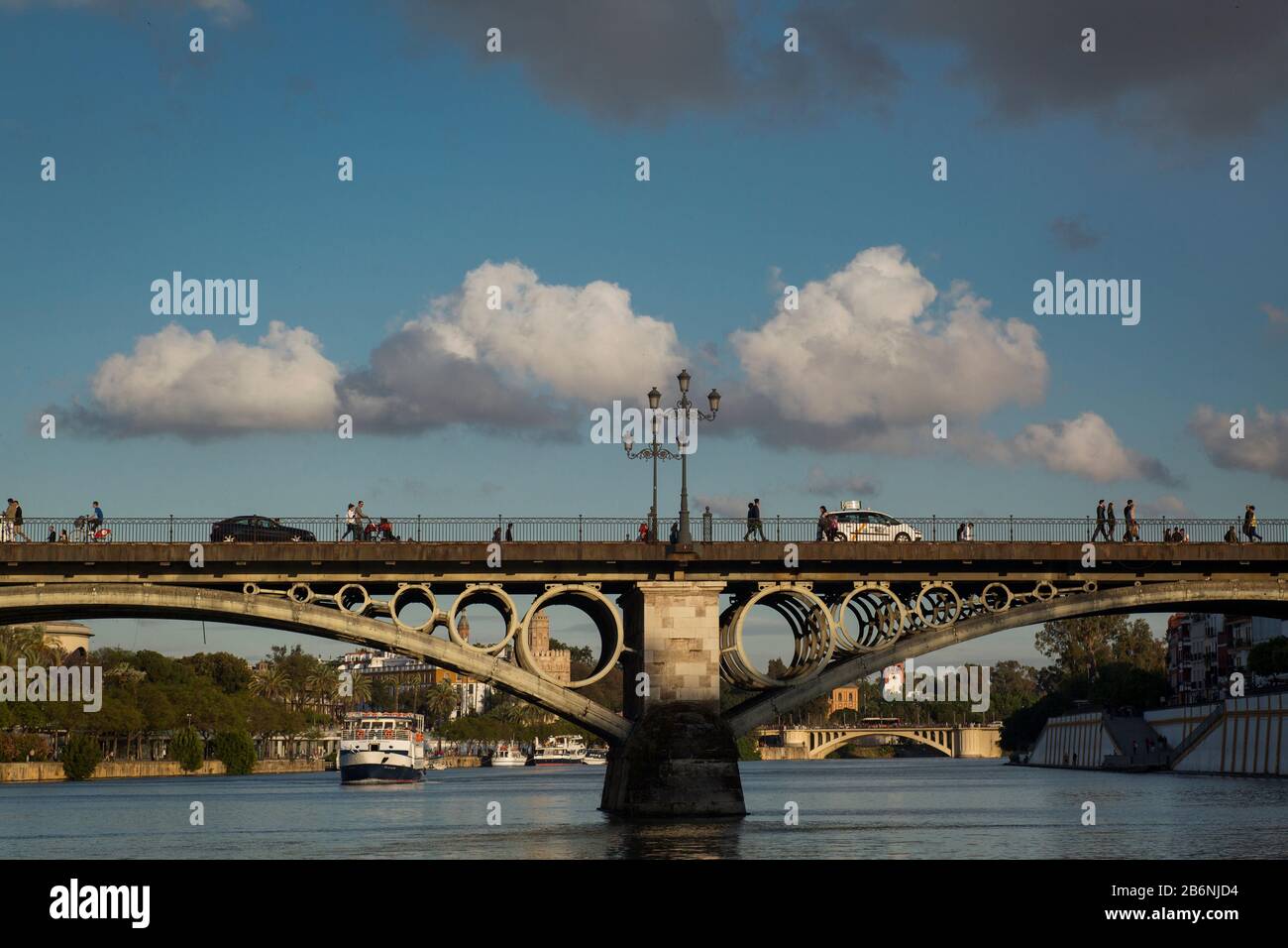 Frontal view of Triana Bridge, Seville’s oldest bridge, over the ...