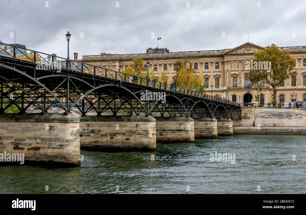 Pont de Arts pedestrian bridge across Seine river and near Louvre ...