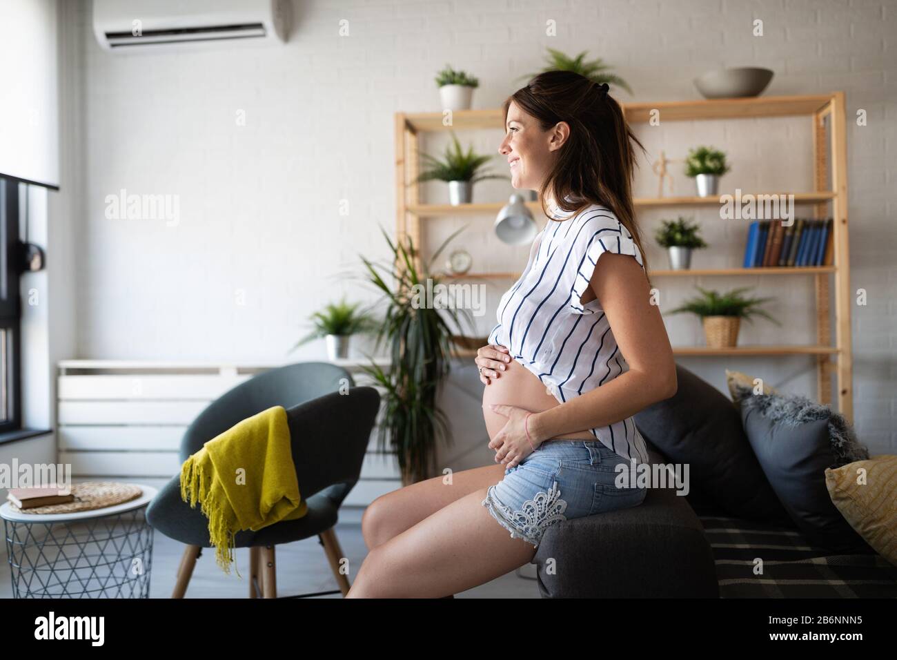 Portrait of beautiful happy pregnant woman expecting baby Stock Photo ...