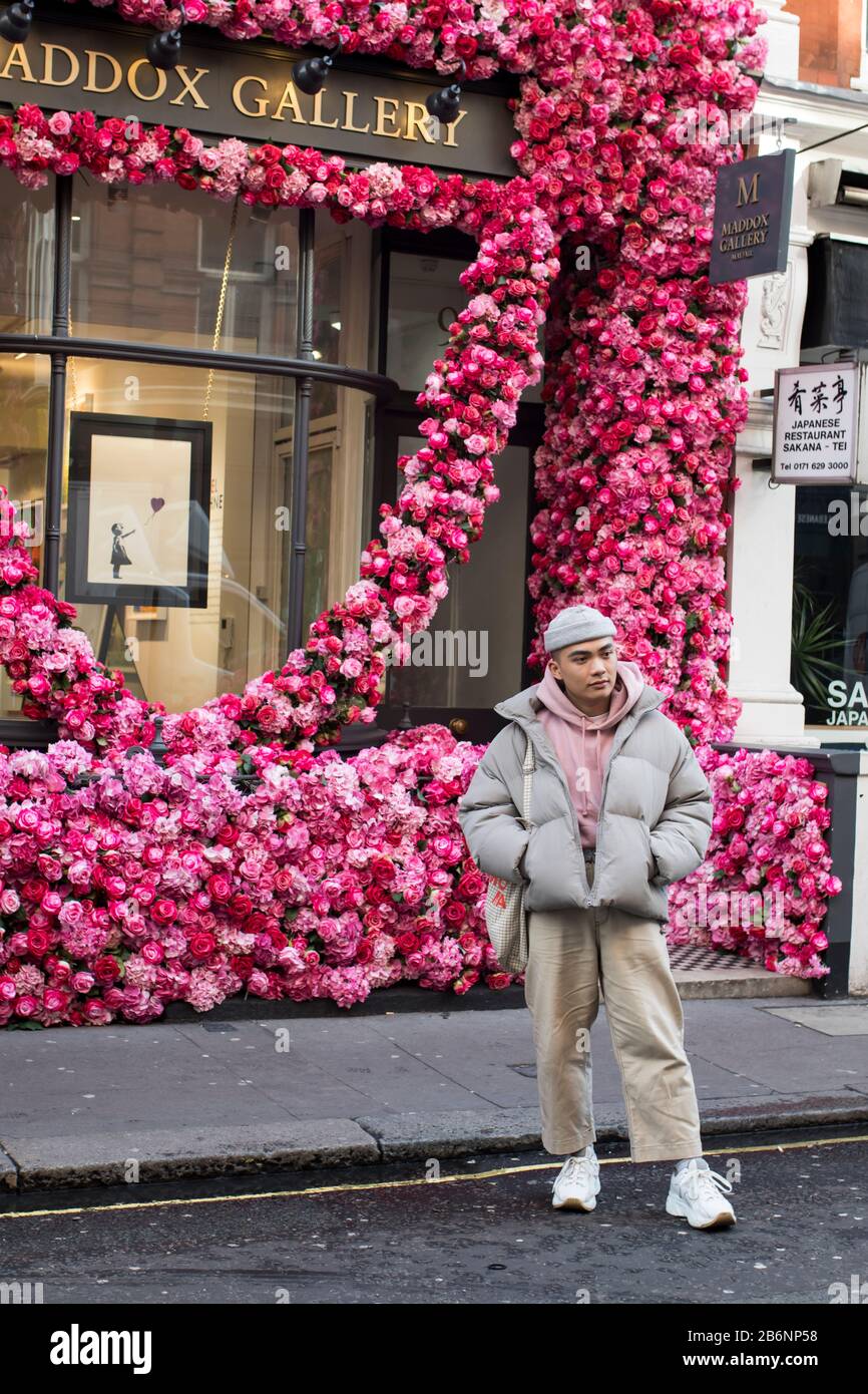 London, UK - 20 February, 2020, A fashionably dressed young man of ...