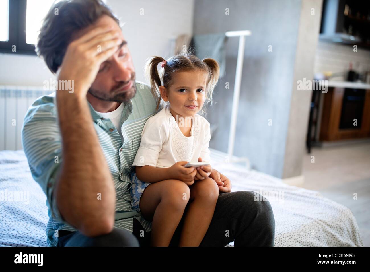 People, children, technology and addiction concept. Little girl with ...