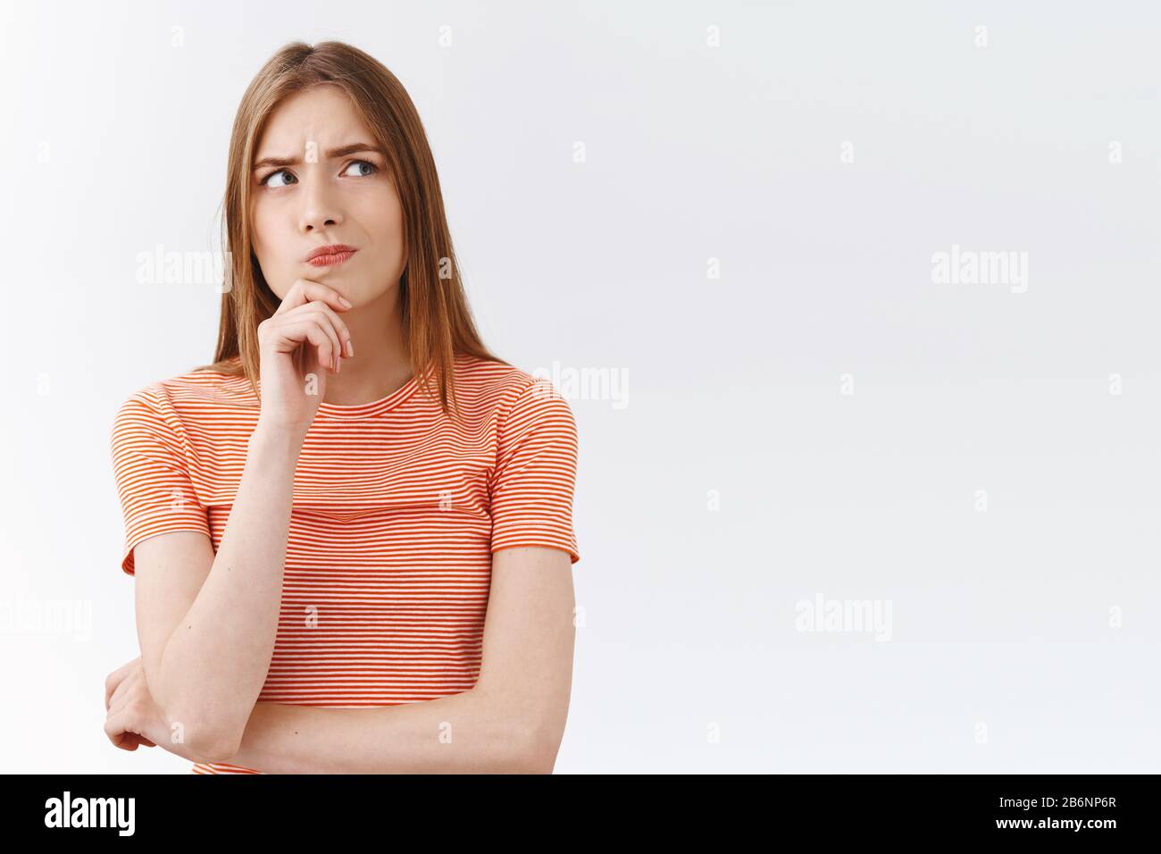 Nervous girl trying find way how solve troublesome situation, touch ...