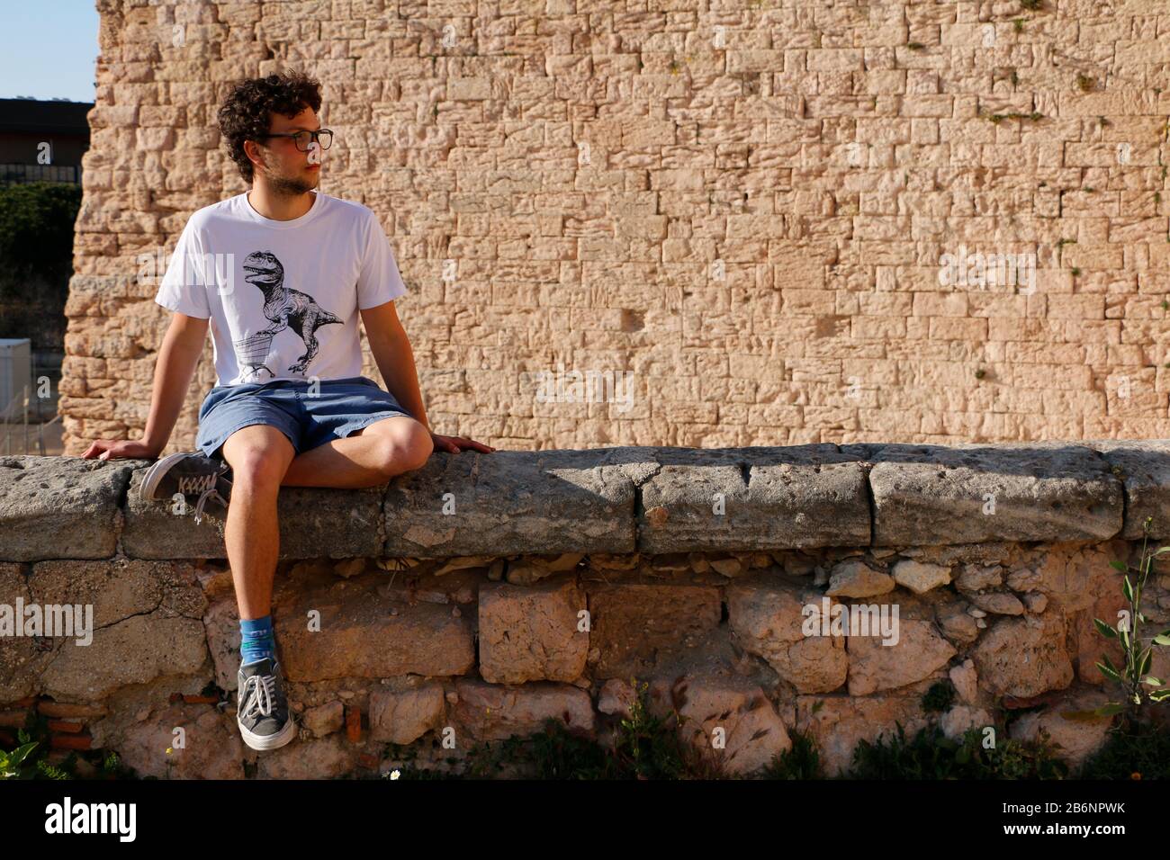 Male model sitting wall hi-res stock photography and images - Alamy