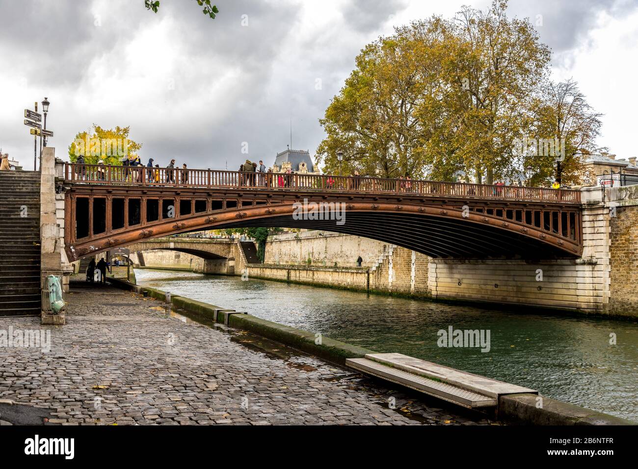 Pont au Double bridge over Seine River leading to Notre-Dame de Paris ...