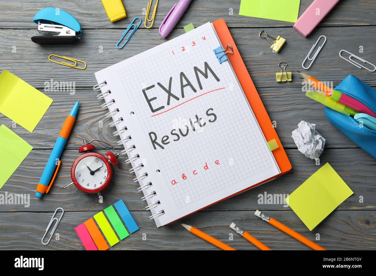 Inscription Exam, Results and stationary on wooden background, top view ...