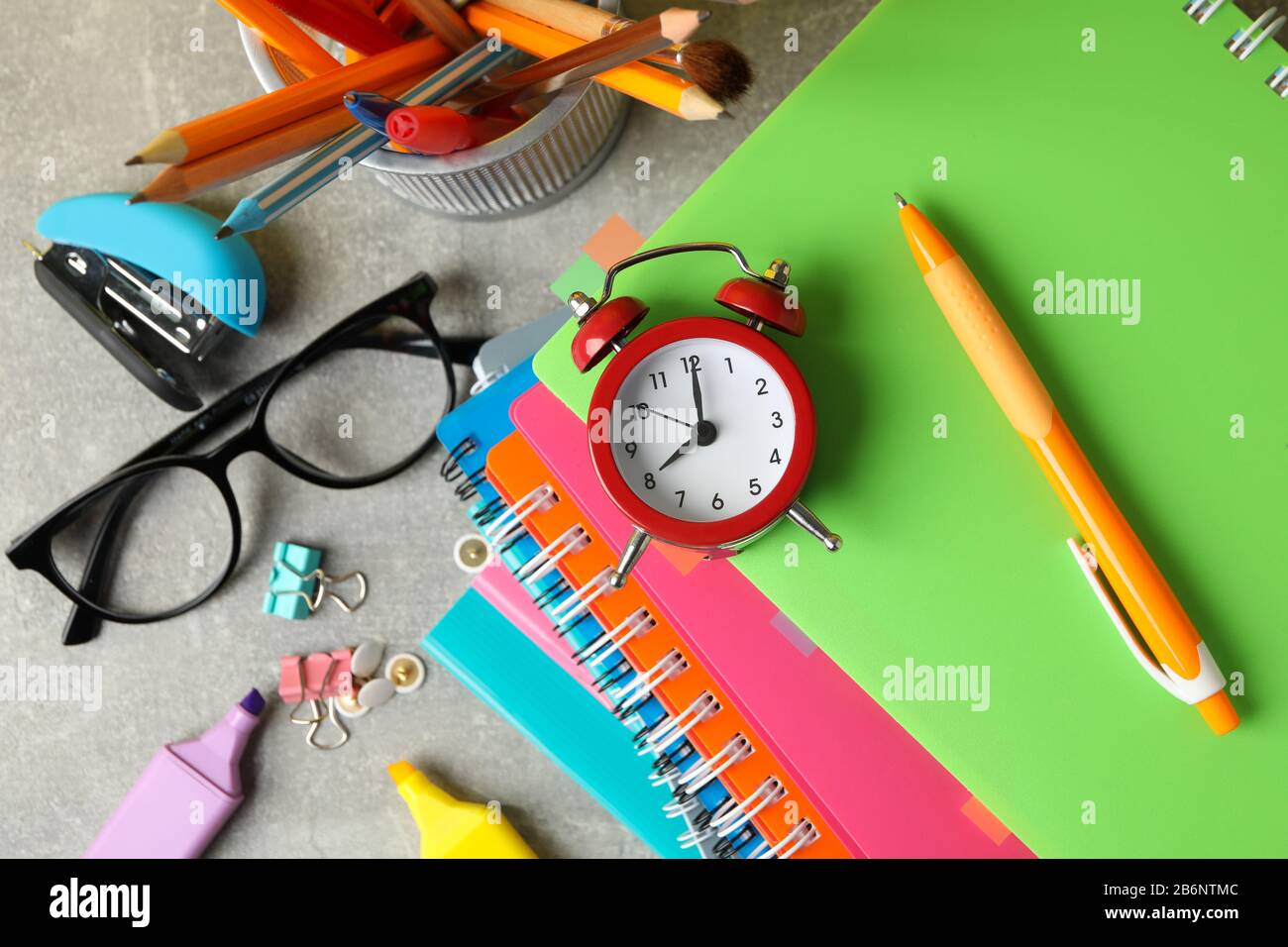 Different stationary on grey background, top view. Study concept Stock ...