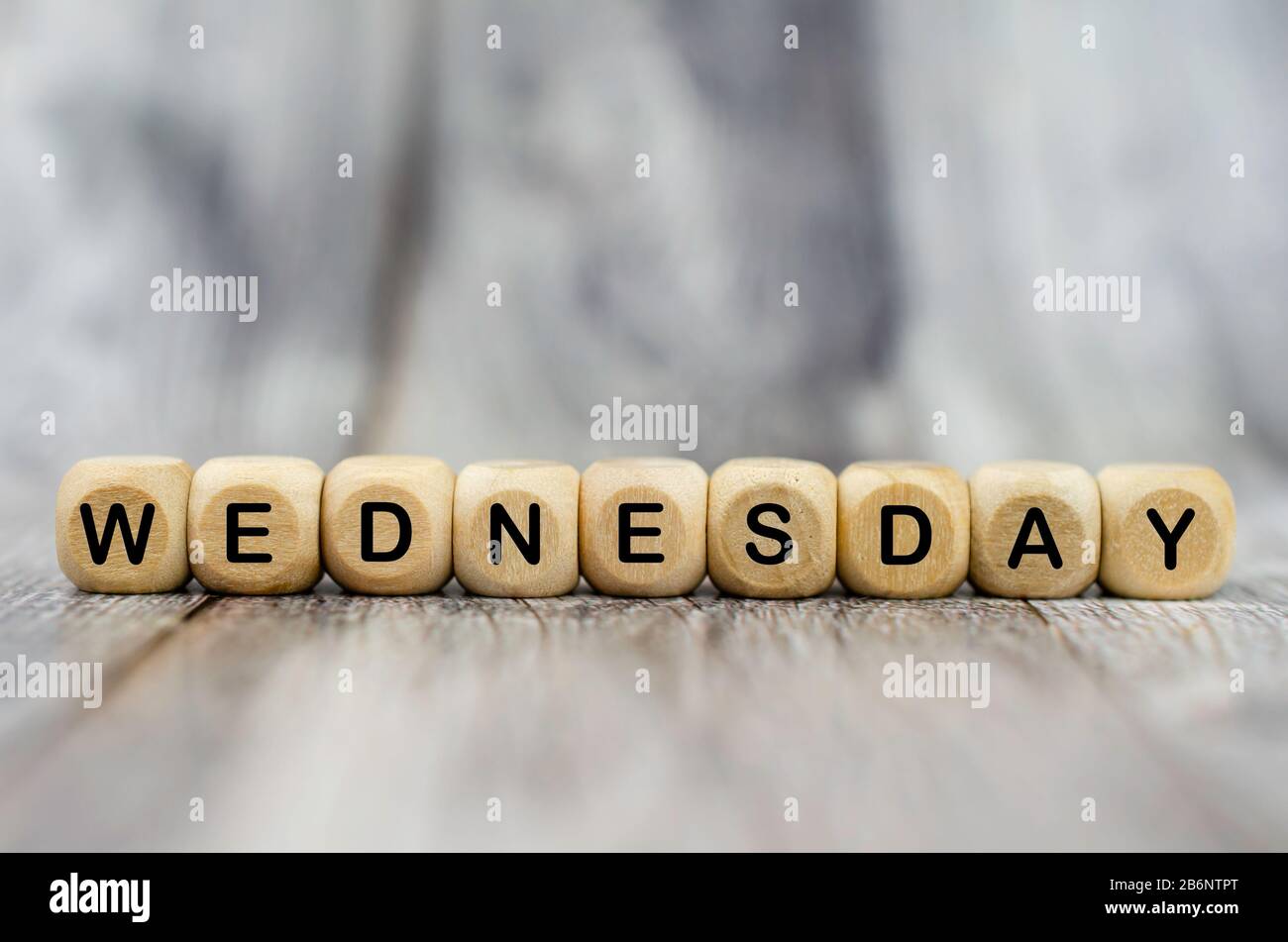 The word Wednesday on wooden cubes. Weekday concept Stock Photo - Alamy