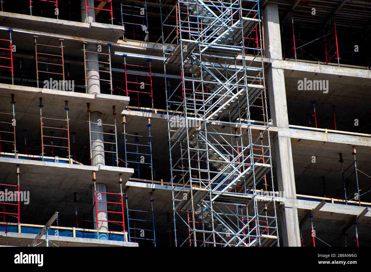 Open faced concrete construction with metal scaffolding stairs Stock ...