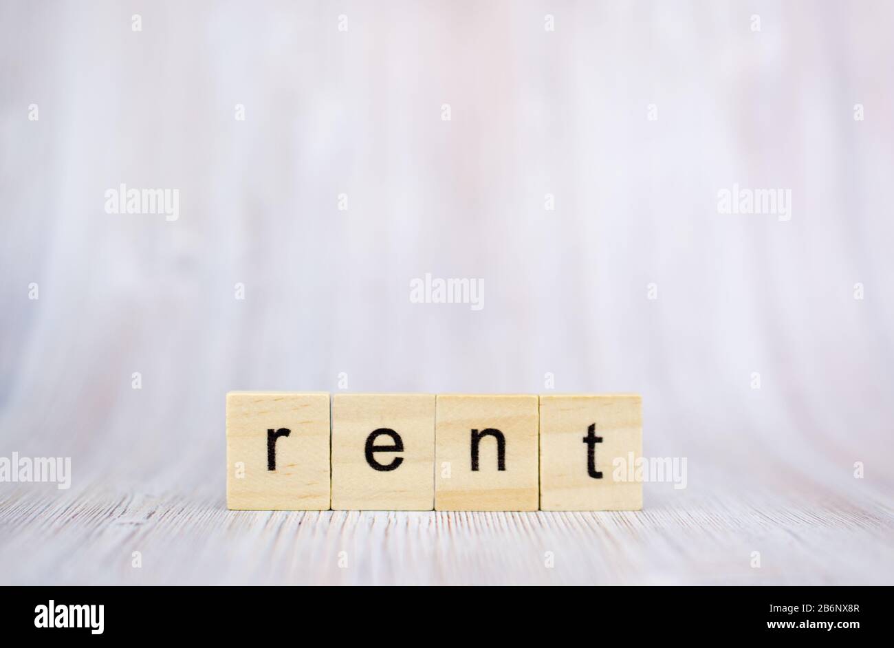 Lettering rent on square wooden cubes . Property investment and house ...