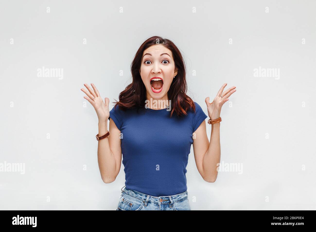 Surprised and happy young emotional woman looking excited Isolated on ...