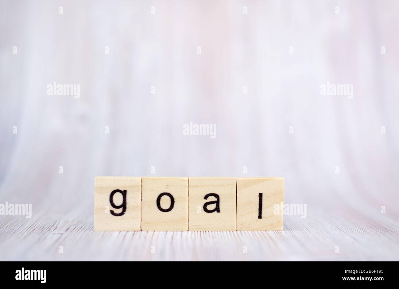 The word goal on wooden cube blocks. Goal concept Stock Photo - Alamy