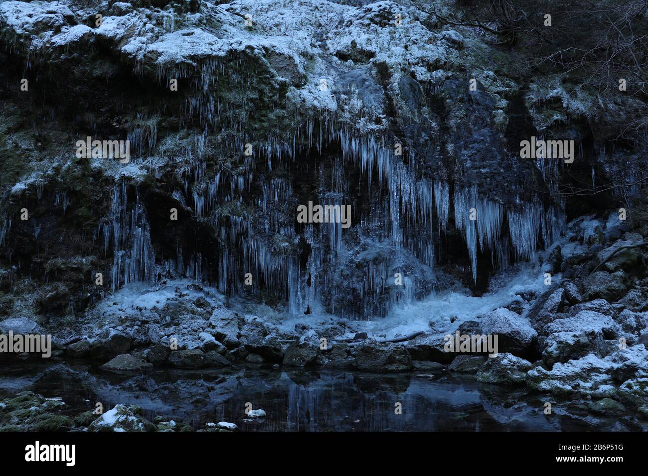 Small pond with icicle on rock, Bohinj valley Stock Photo - Alamy