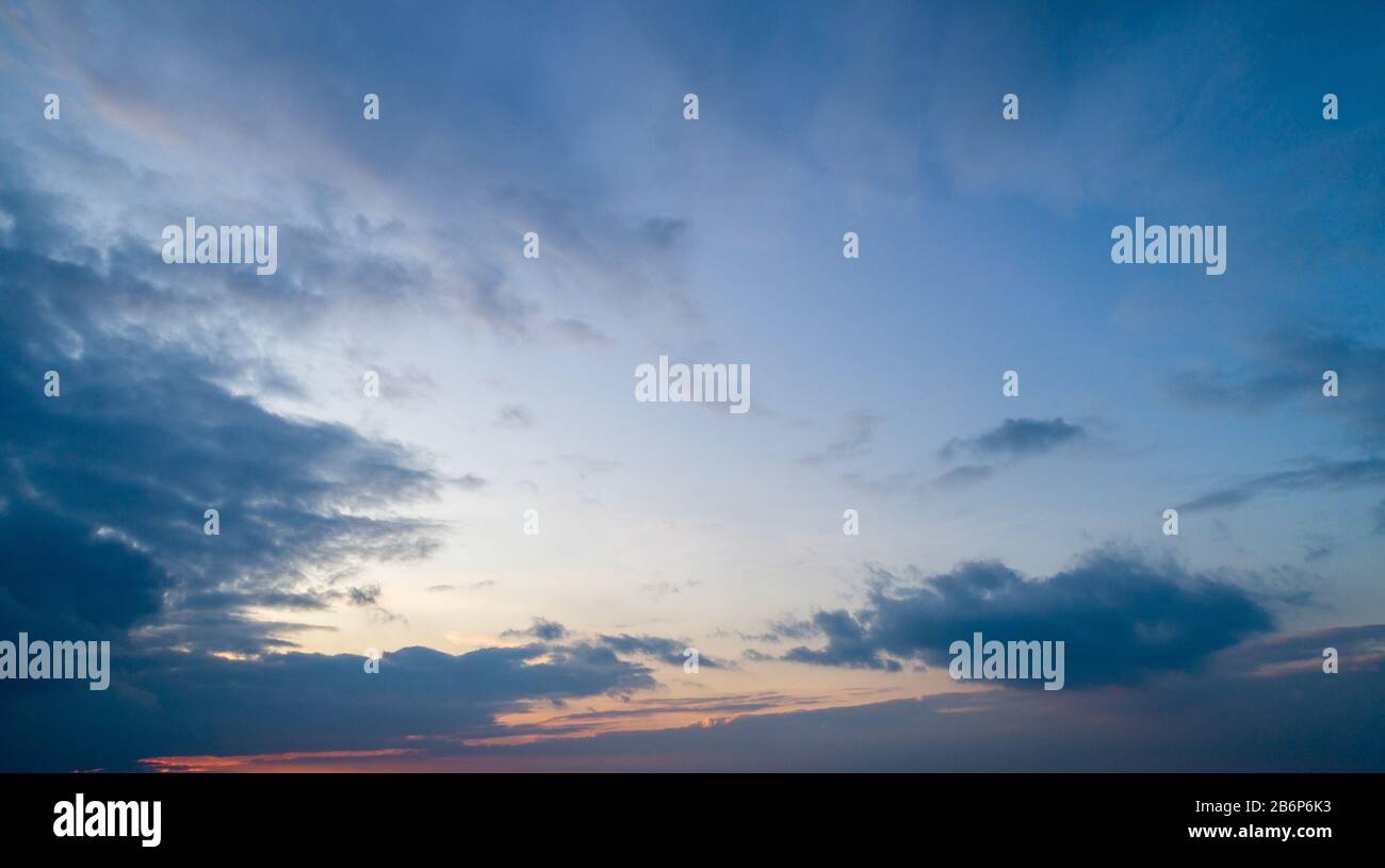 Beautiful sky with stretched clouds during twilight Stock Photo - Alamy