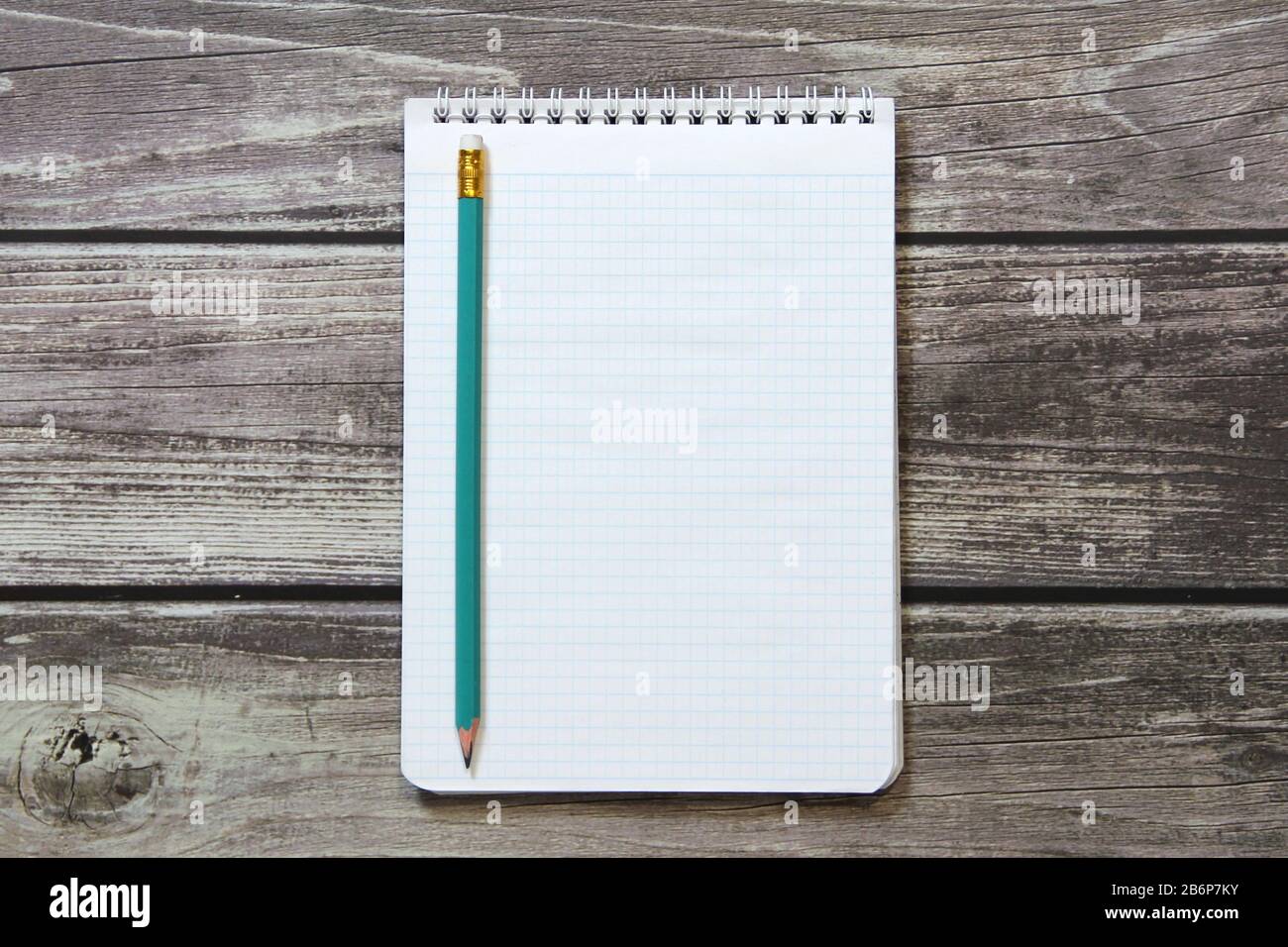 Notepad with a blank white sheet in a checker paper with simple ...