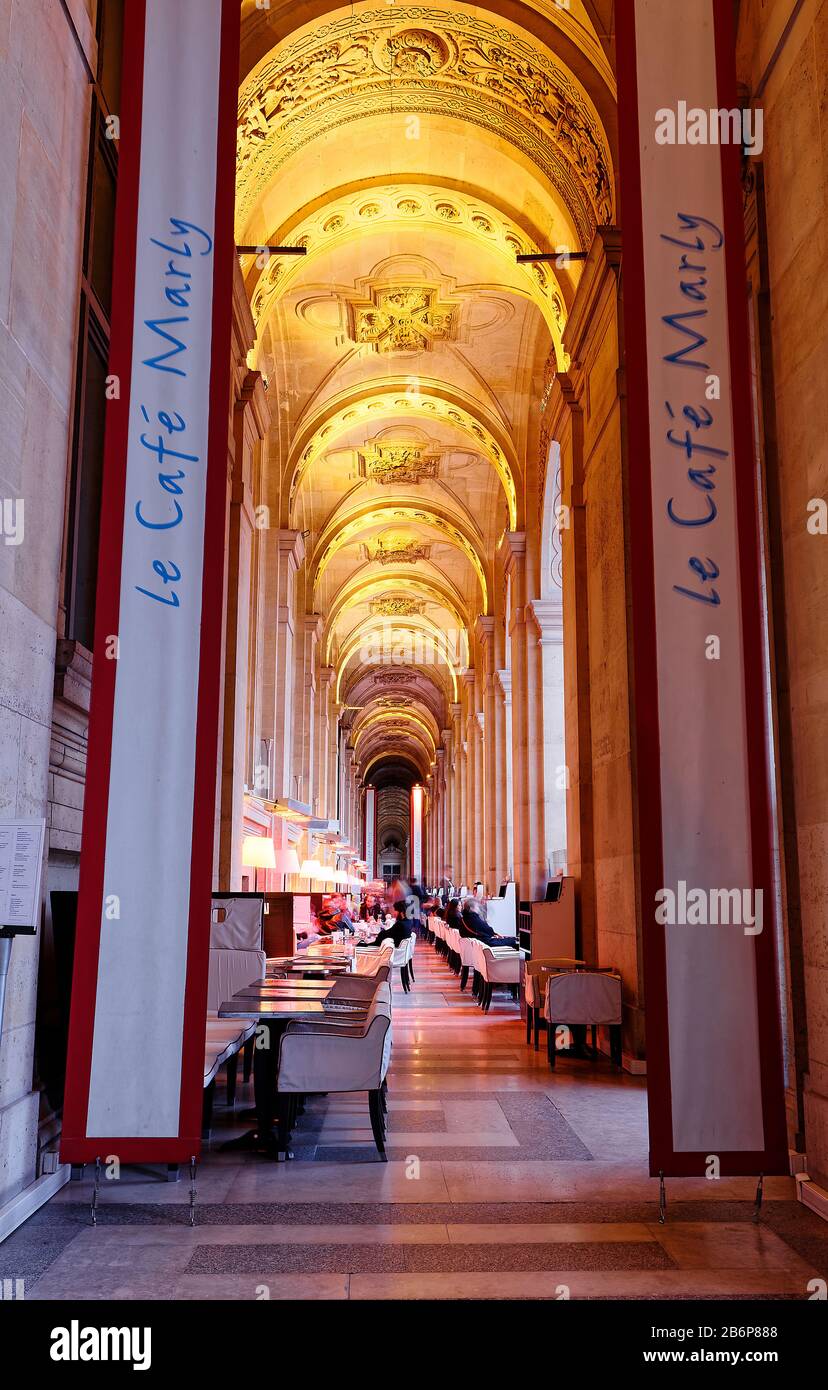 Located beneath the arcades of the Louvre museum , cafe Marly is the ...
