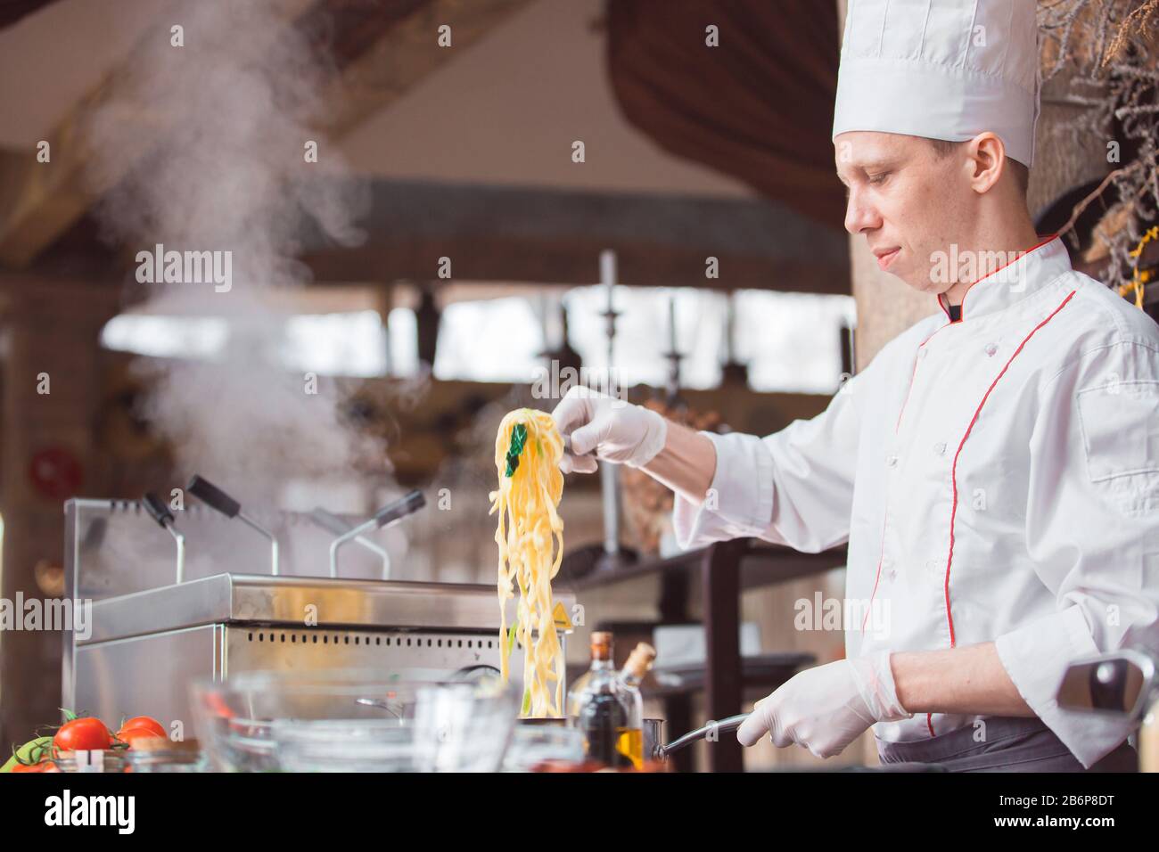 chef cooks spaghetti in a premium restaurant Stock Photo - Alamy
