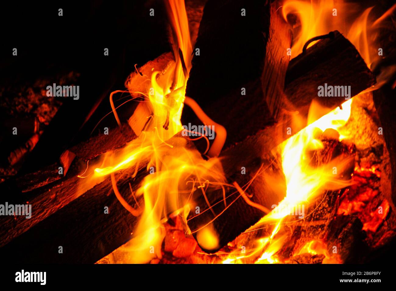 Macro shot of burning firewood with an open flame. Fire close Stock ...