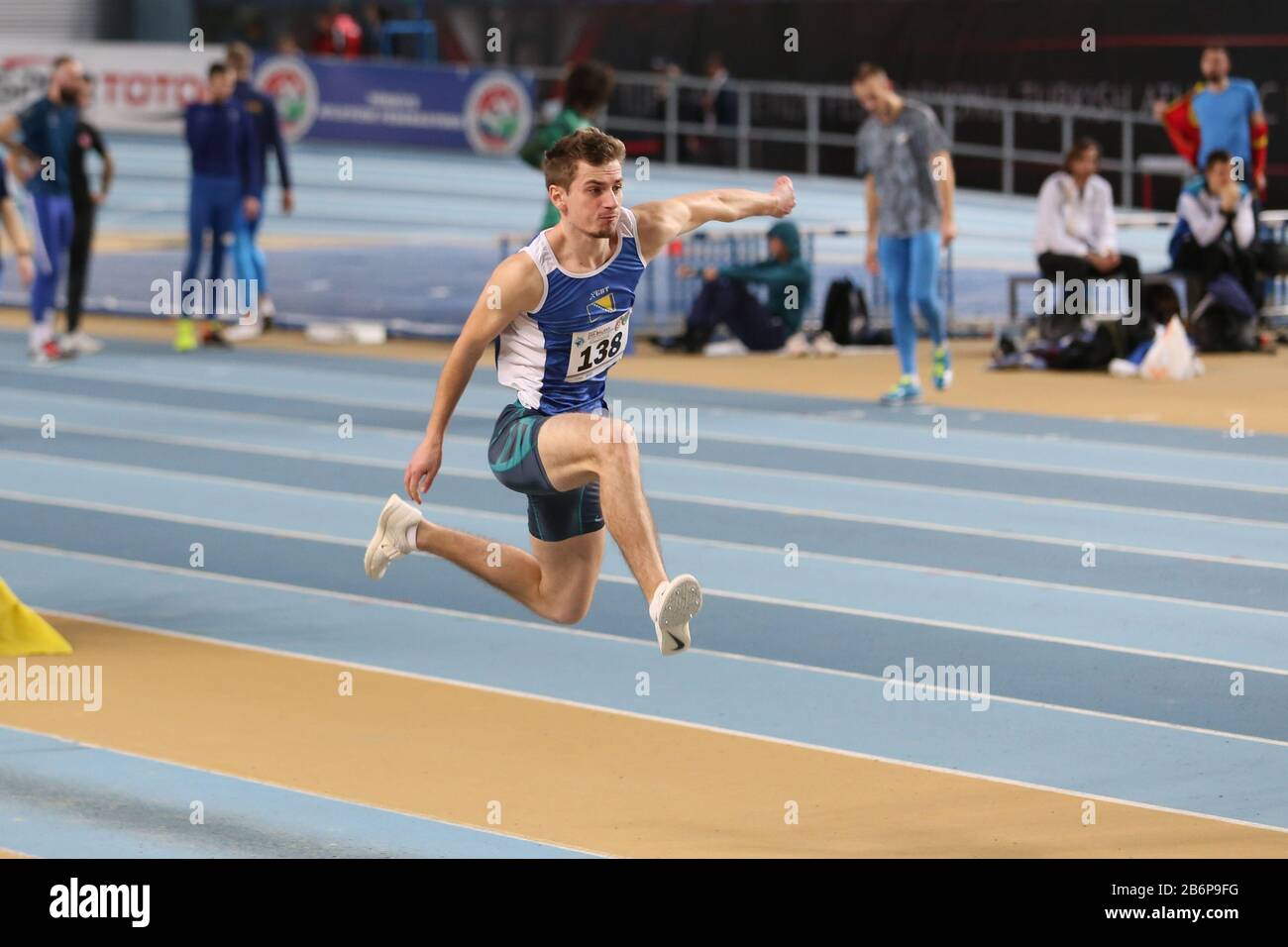 ISTANBUL, TURKEY - FEBRUARY 15, 2020: Undefined athlete triple jumping ...