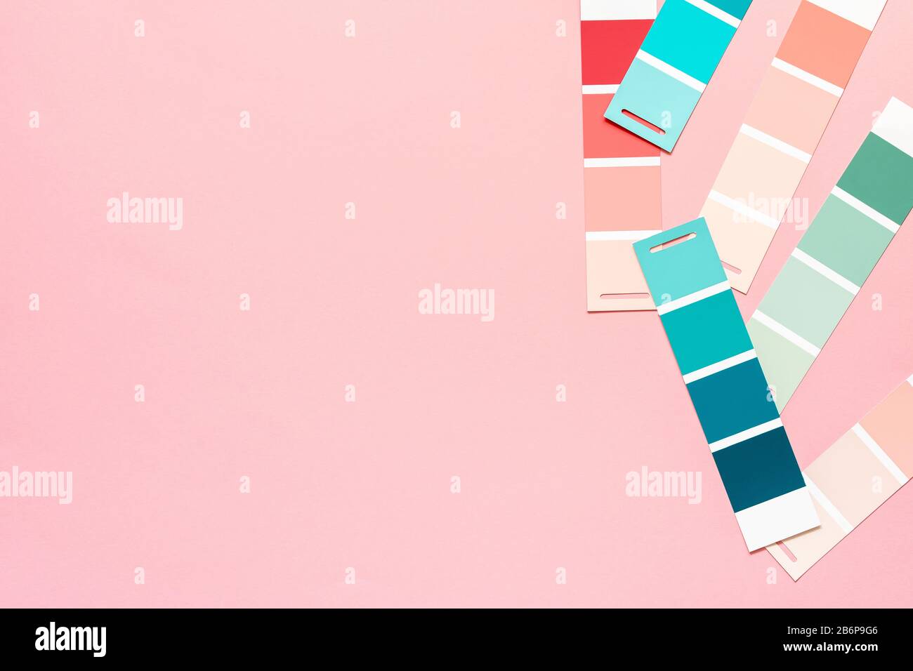 Selection of palette for painting, sample color catalog on a pink ...