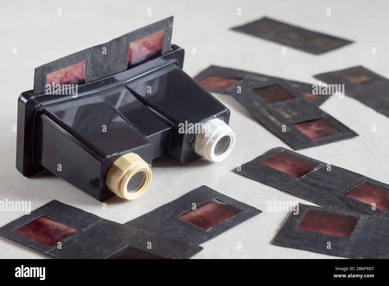 Old plastic stereoscope with a stereo card. Outdated 3D viewing device ...