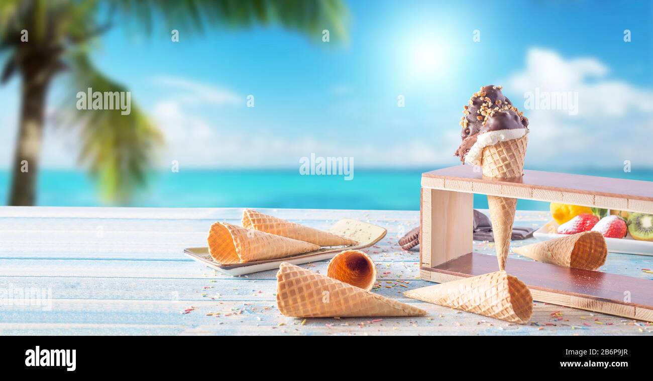 ice cream cone on sunny beach Stock Photo - Alamy