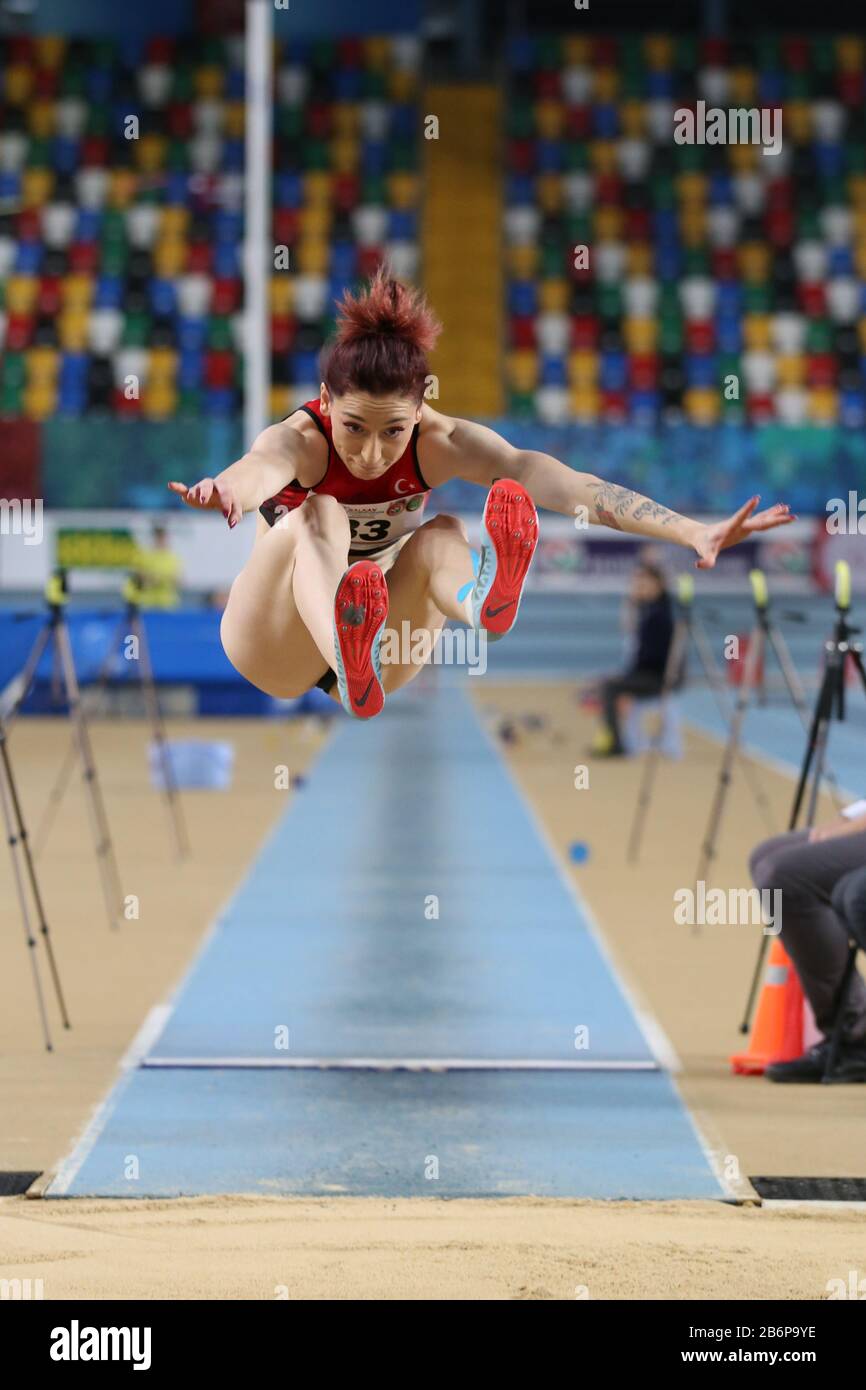 ISTANBUL, TURKEY - FEBRUARY 15, 2020: Undefined athlete long jumping ...