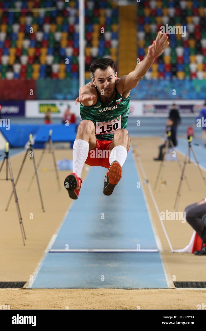 ISTANBUL, TURKEY - FEBRUARY 15, 2020: Undefined athlete long jumping ...