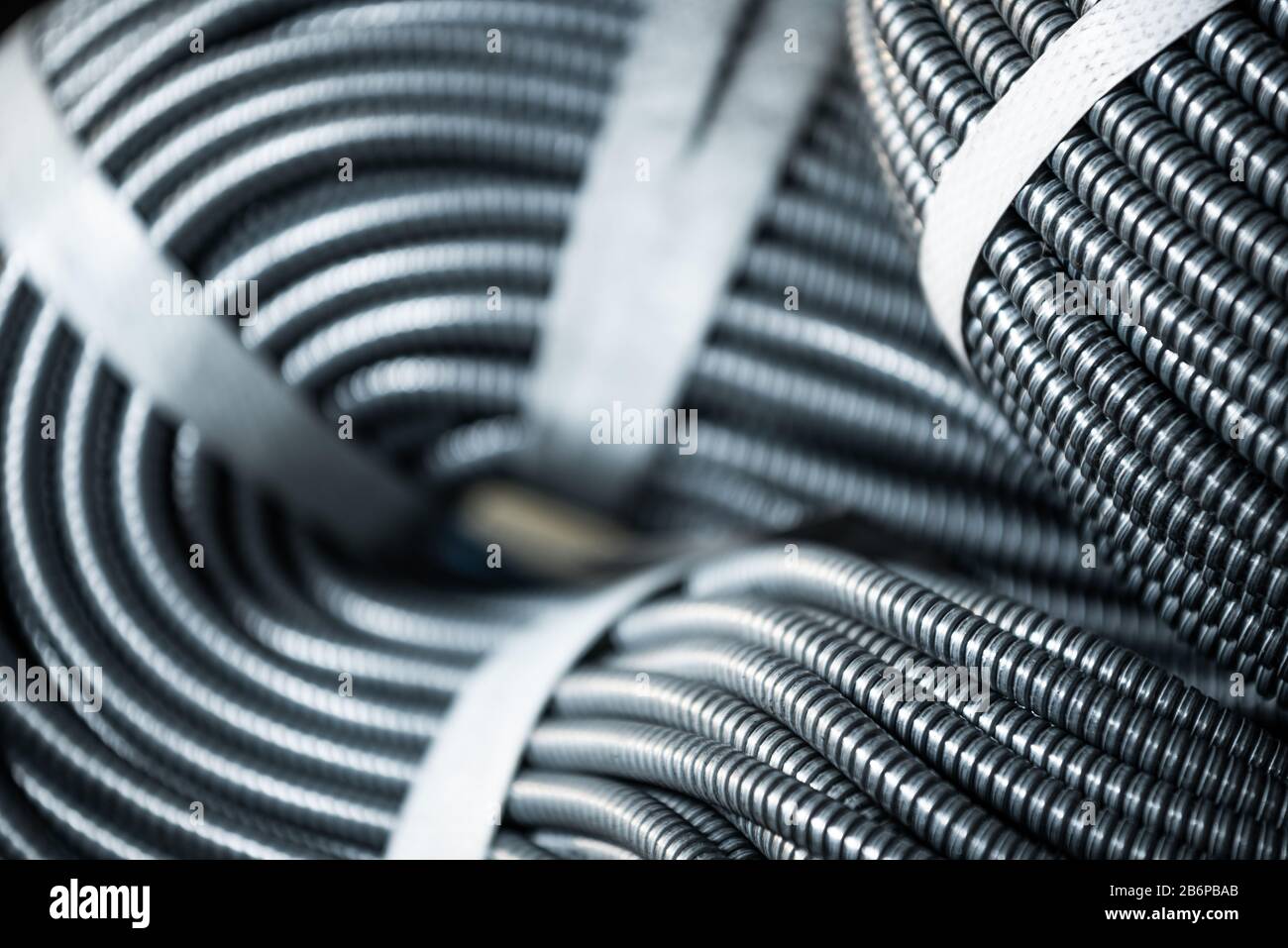 Close-up of a huge bundle of metal flexible tubes interconnected in a ...