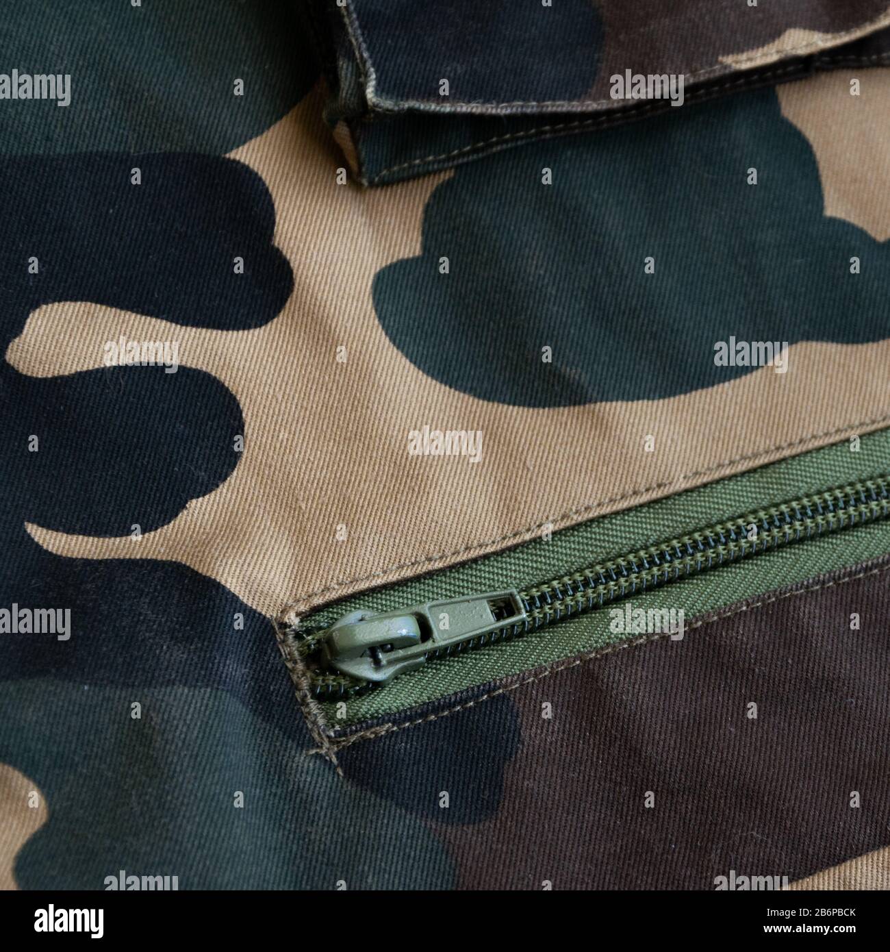 Part of military camouflage cloth, army fabric clothing Stock Photo - Alamy