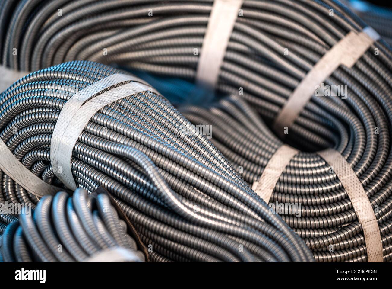 Close-up of a huge bundle of metal flexible tubes interconnected in ...