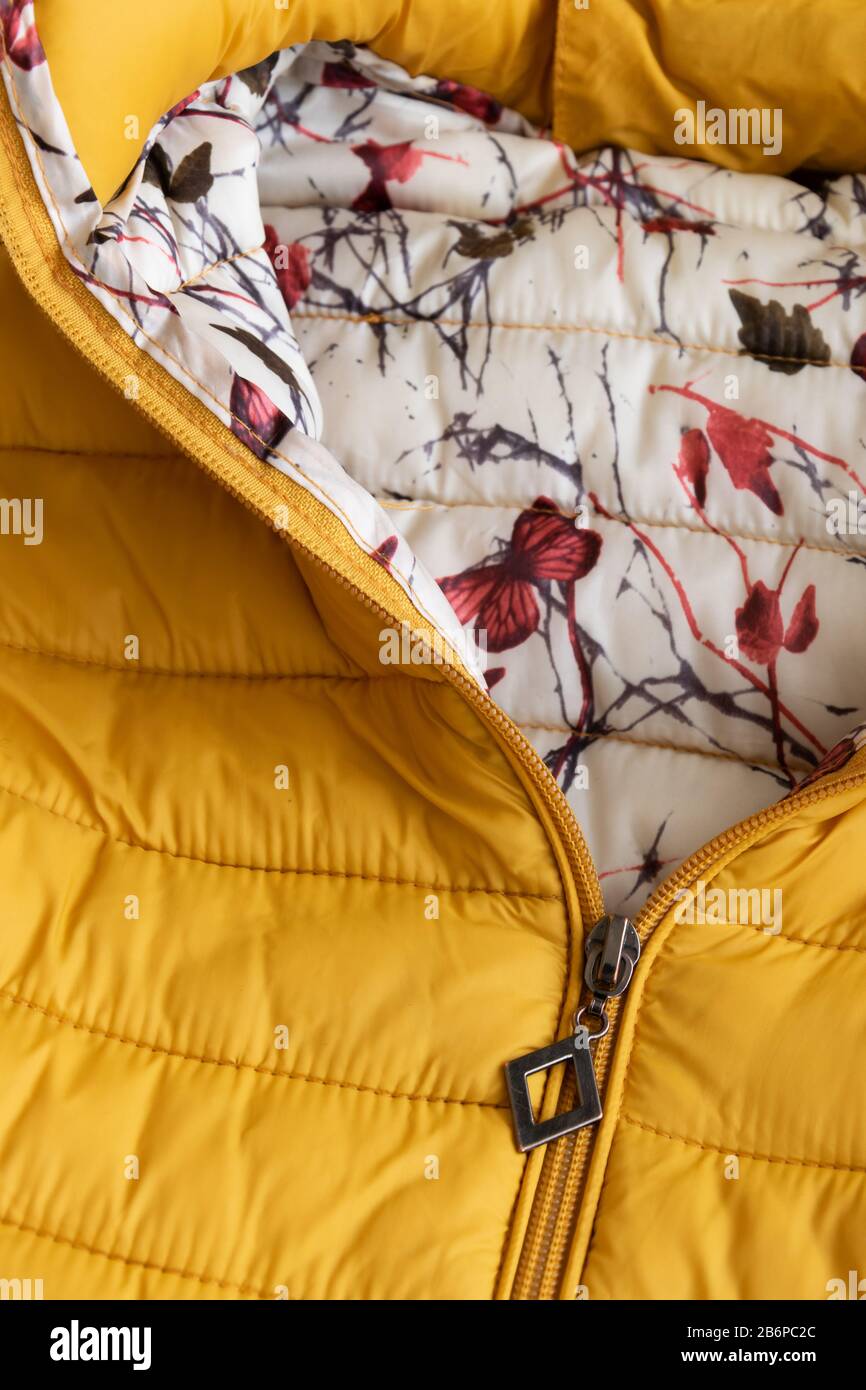 Yellow puffer jacket hi-res stock photography and images - Alamy