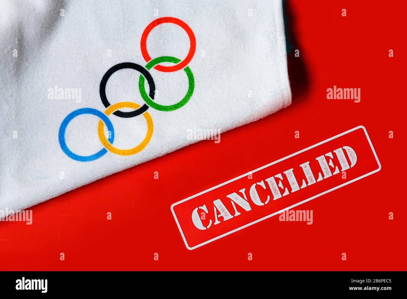 TOKYO, JAPAN, MARCH. 11. 2020: Olympic rings, tittle Canceled, red ...
