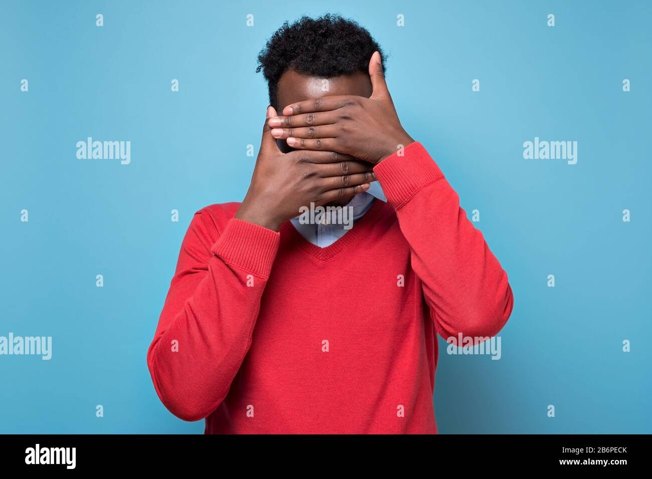 Person trying to hide face with hand hi-res stock photography and ...