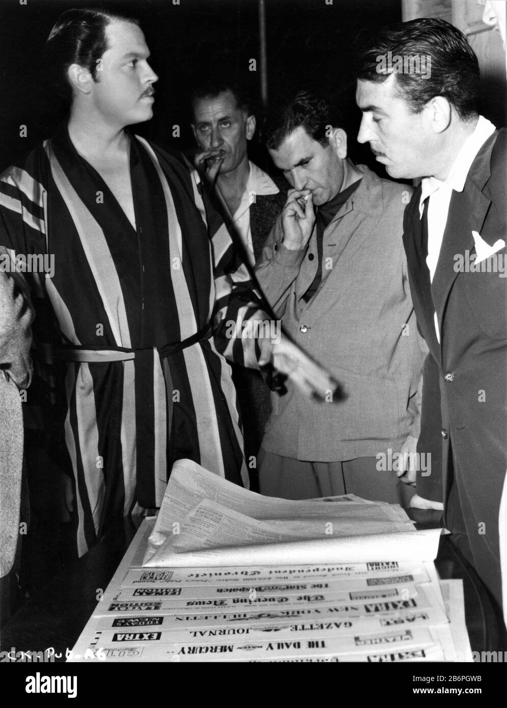 ORSON WELLES in costume as Charles Foster Kane with movie crew on set ...