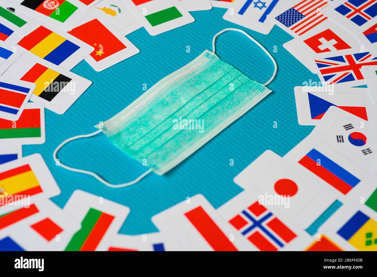 Surgical mask and world flags, Coronavirus pandemic, concept photo ...
