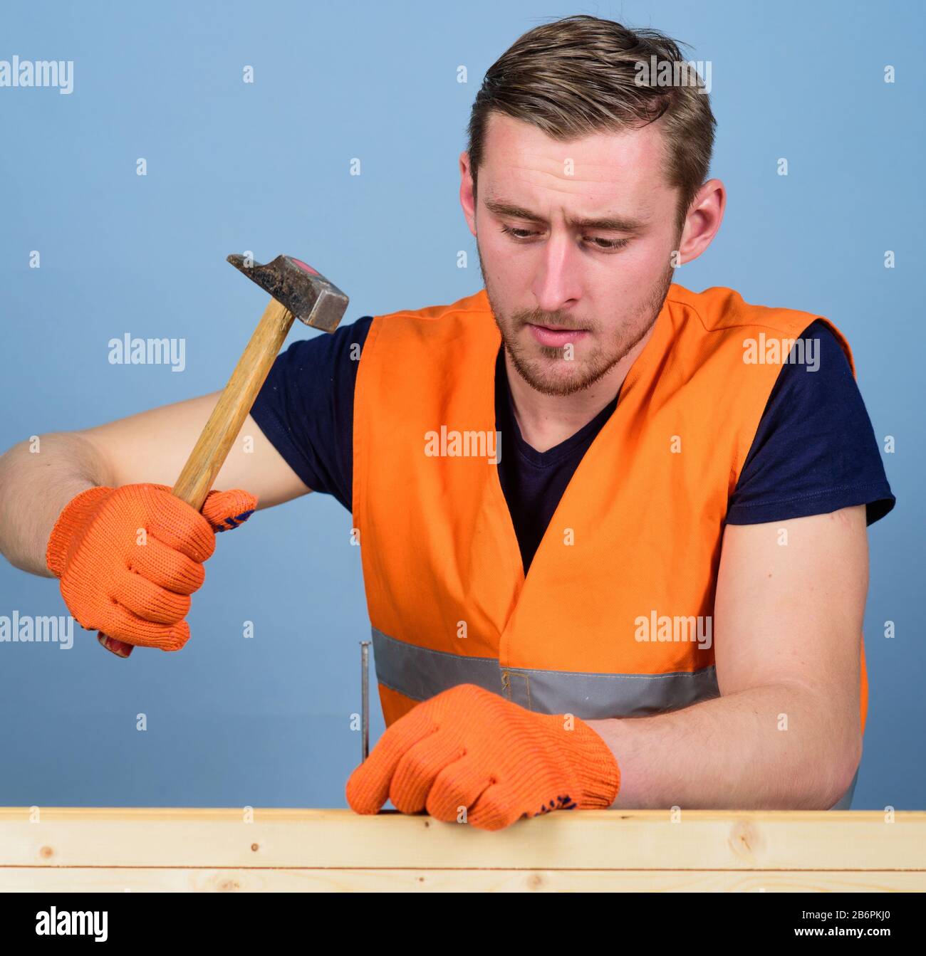 Carpenter concept. Man, handyman in working uniform and protective ...